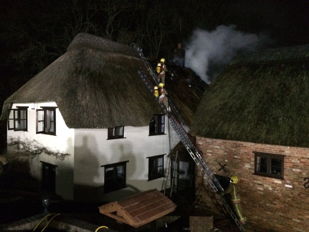 Around 100 firefighters tackle thatched roof blaze - ITV News
