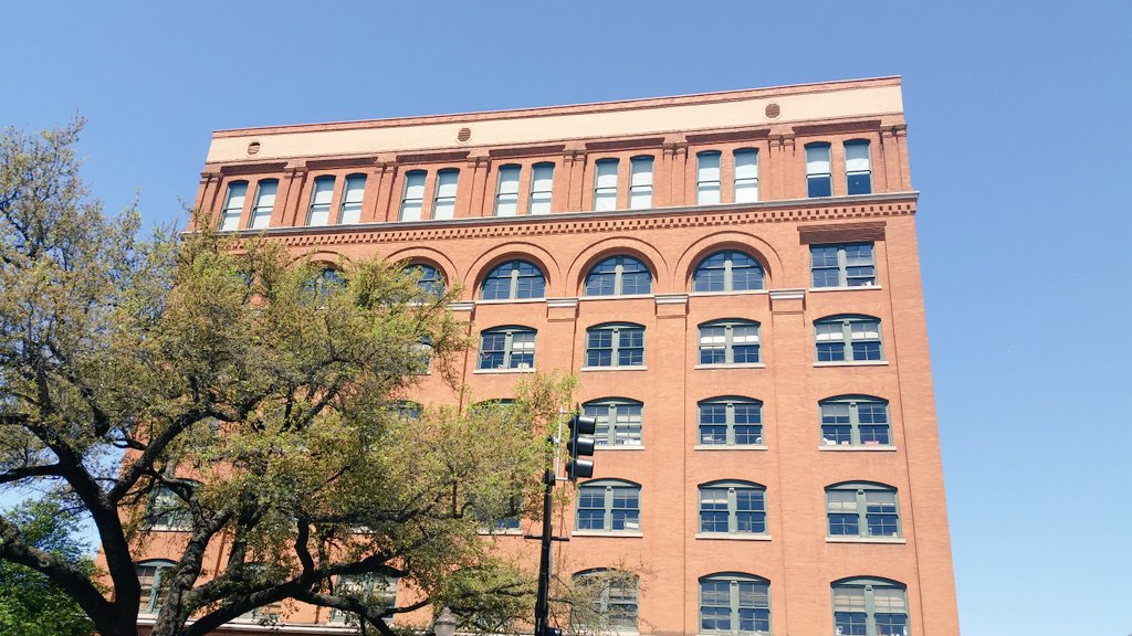 Texas School Book Depository building and six floor window where sniper ...