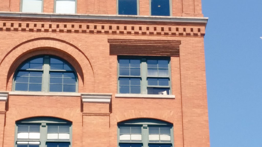 Texas School Book Depository building and six floor window where sniper ...