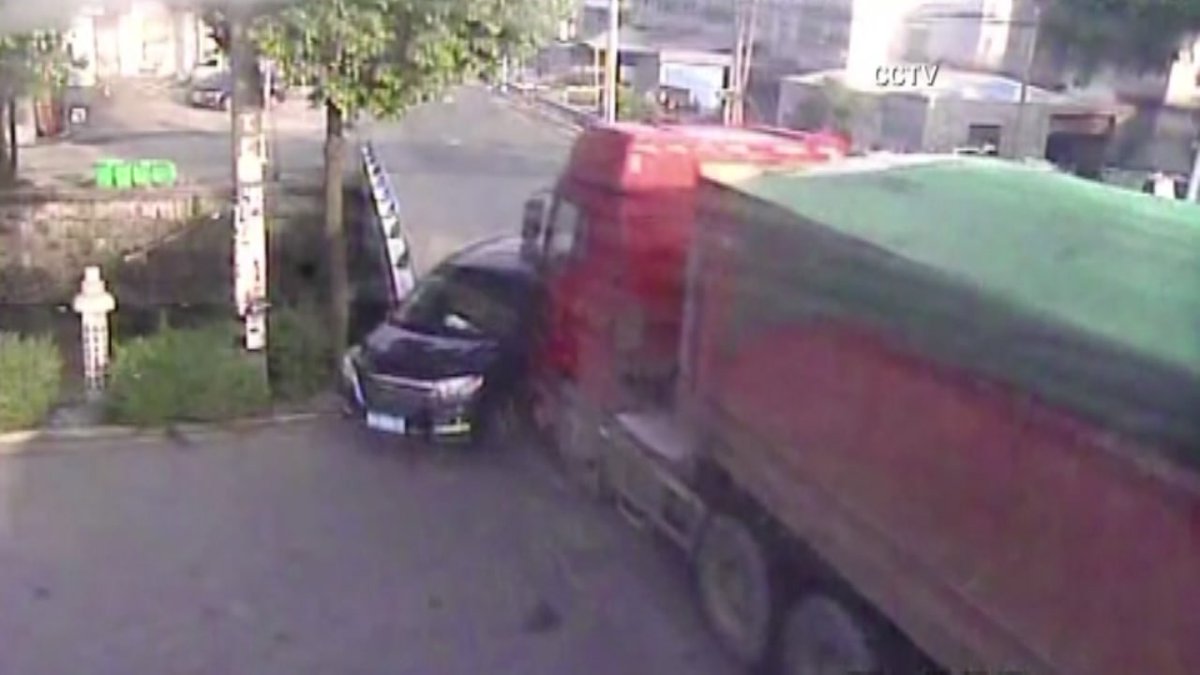 VIDEO: A truck crash sends a car teetering on a bridge (and the edge of ...