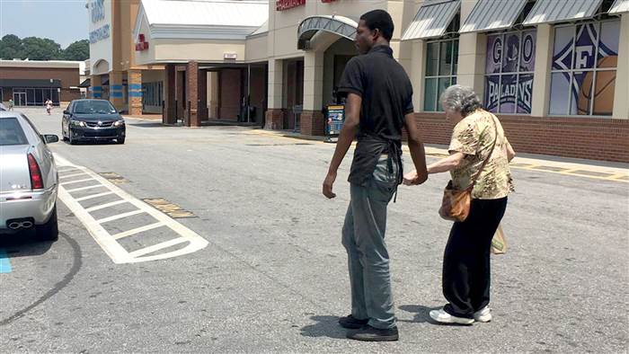 Helping Elderly Cross The Street