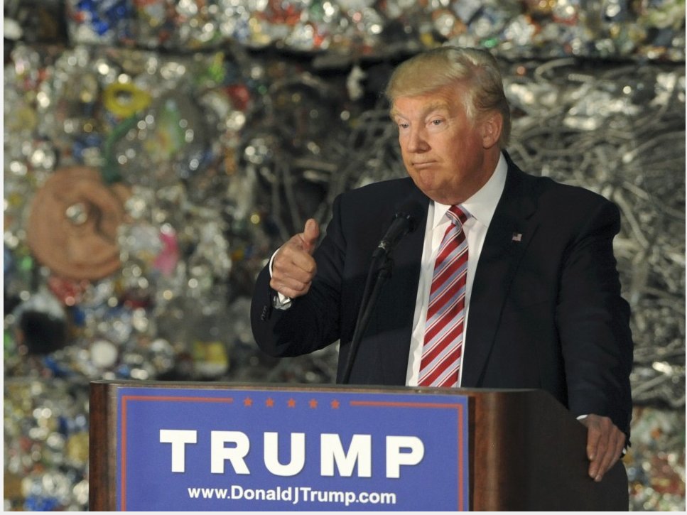 Trump is giving a speech in front of a massive garbage pile and the ...