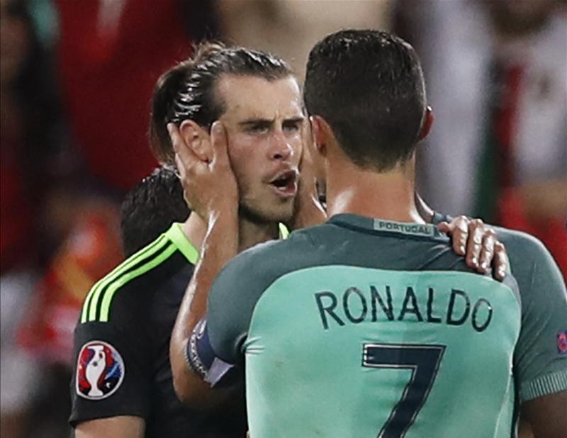 Cristiano ronaldo comforting gareth bale at the final whistle. he did ...