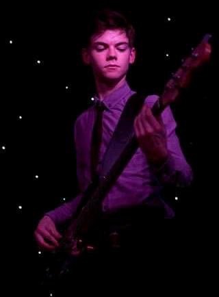 Thomas Sangster Playing Guitar