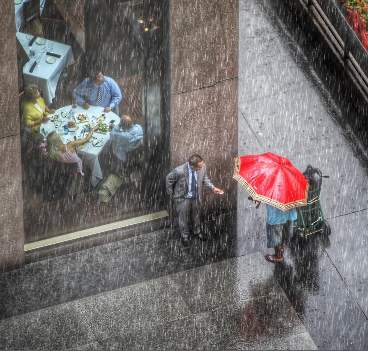 : Spotted: A man caught in today's crazy rain storm buying an umbrell...