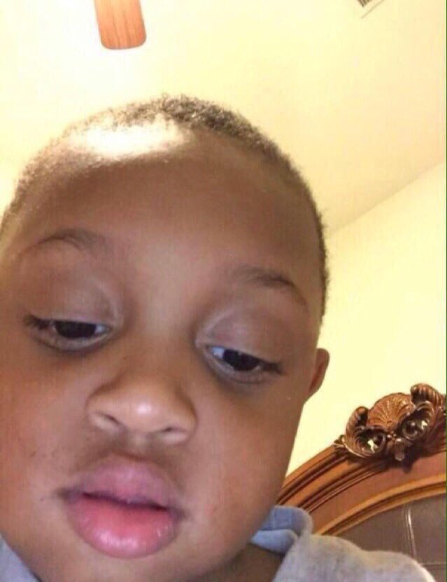 Creepy Black Kid Smiling Meme