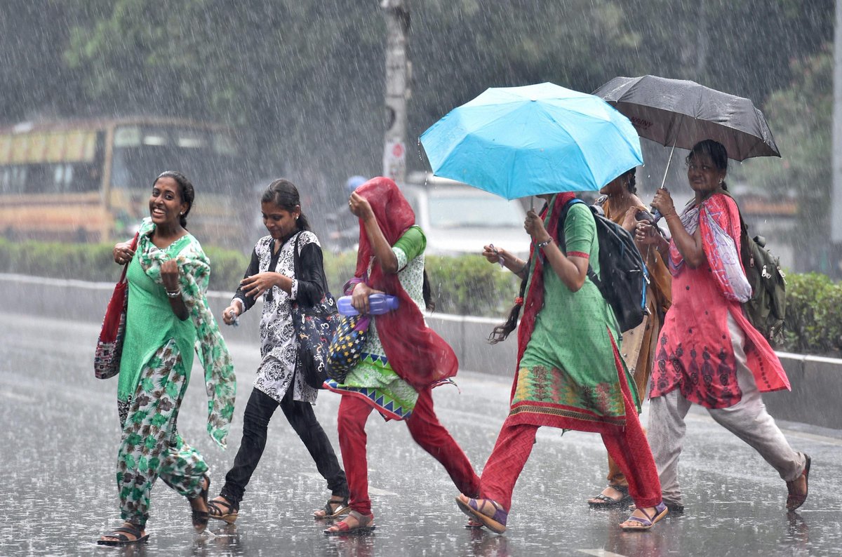 College girls walk in rain in Chennai. | All India Radio News | Scoopnest