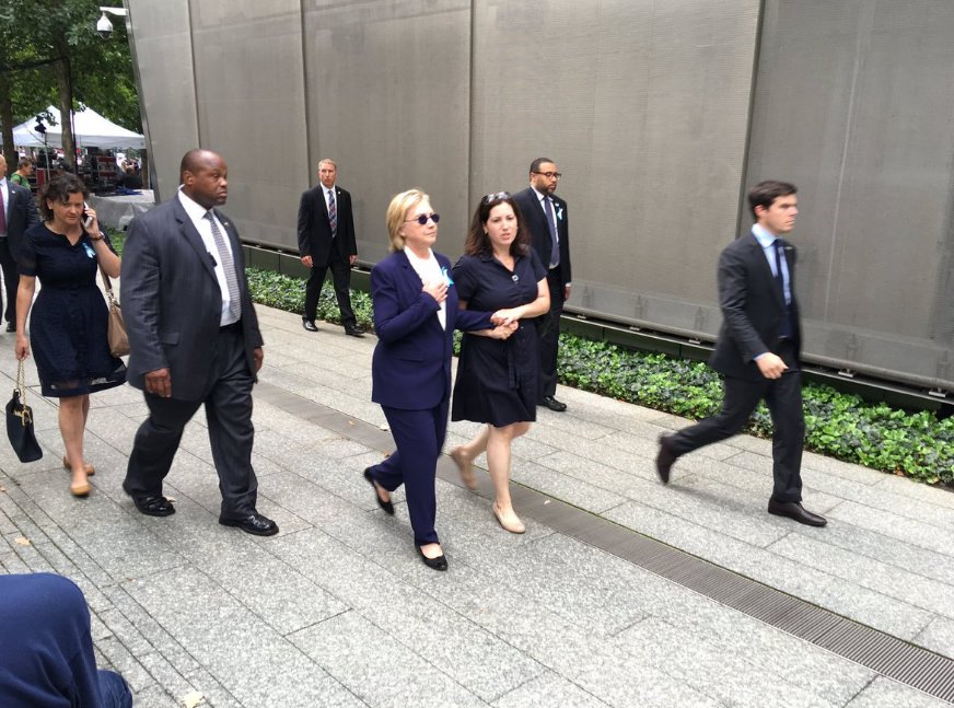 (VANITY)Sick Hillary is trailed by her hypnotist/handler while a nurse ...