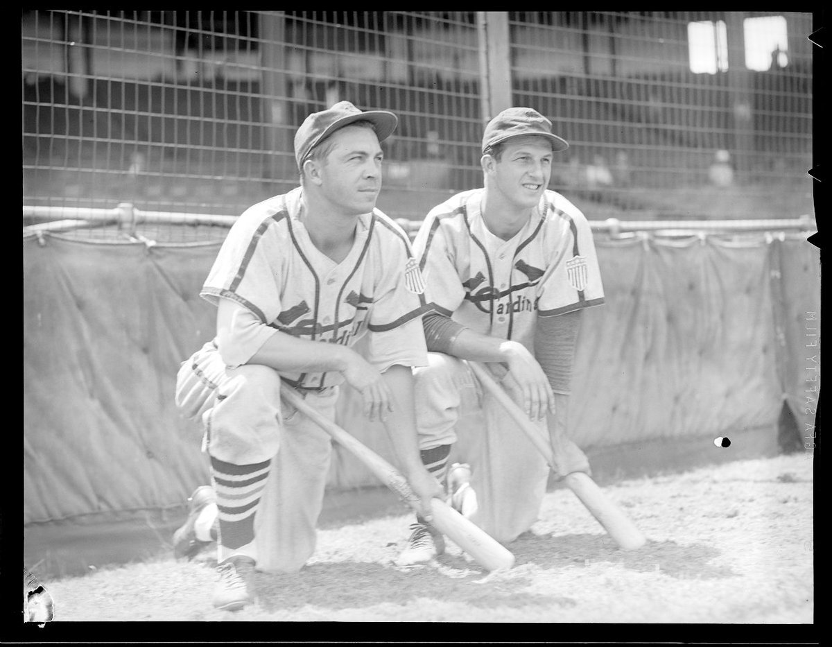 St. Louis Cardinals Johnny Hopp and Stan Musial in front of the screen ...