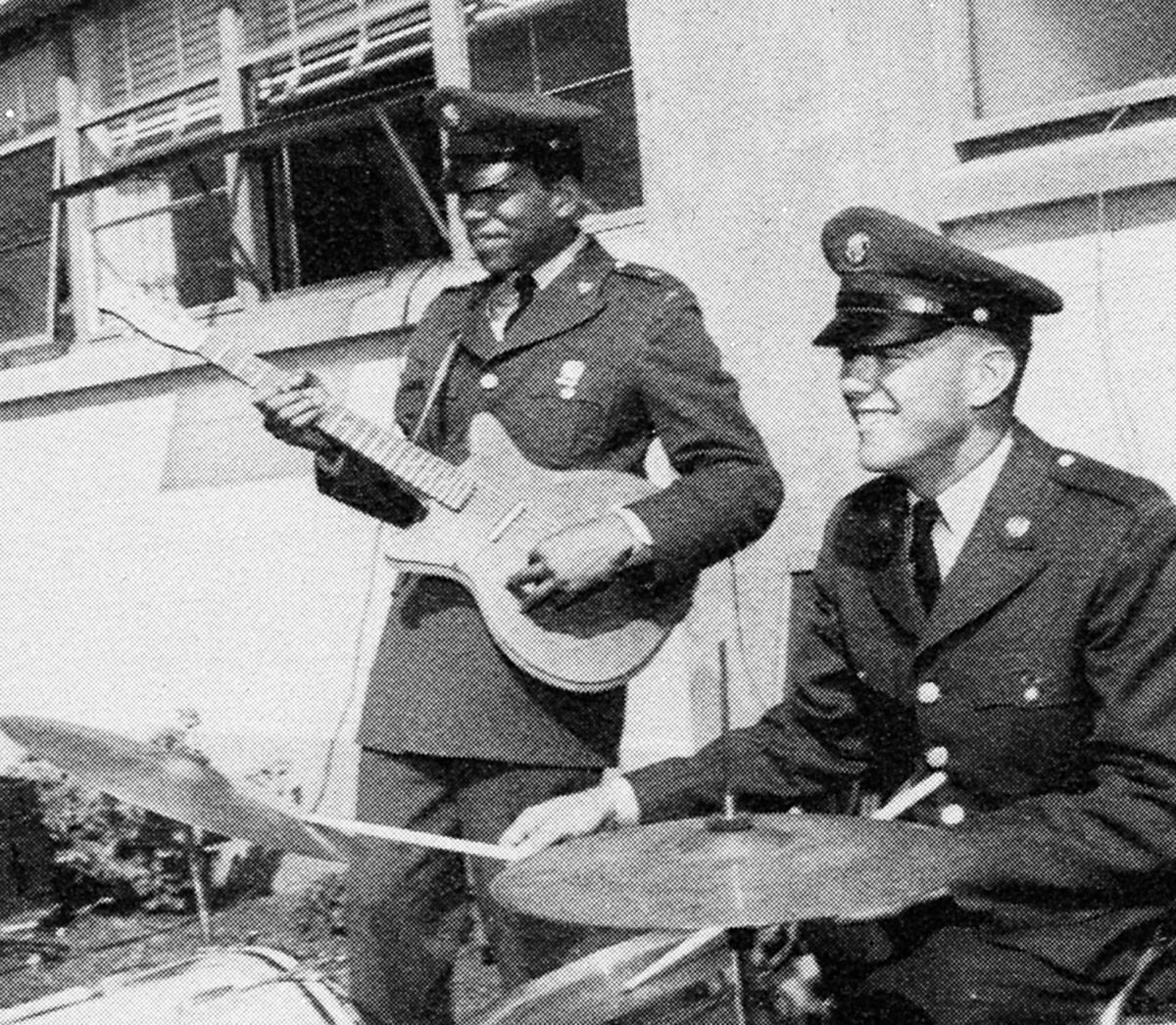 Jimi Hendrix playing guitar in US Army uniform, 1961. | History In ...