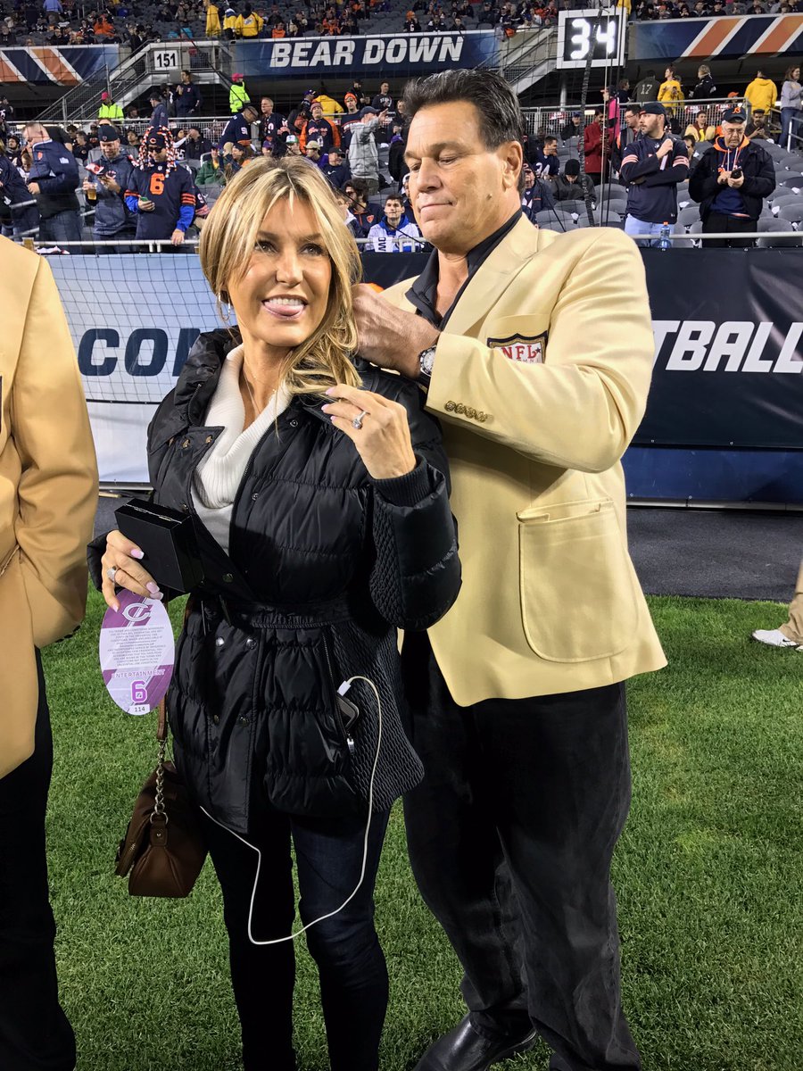 Dan Hampton: . Dan Hampton gives his wife a pendant before he receives ...