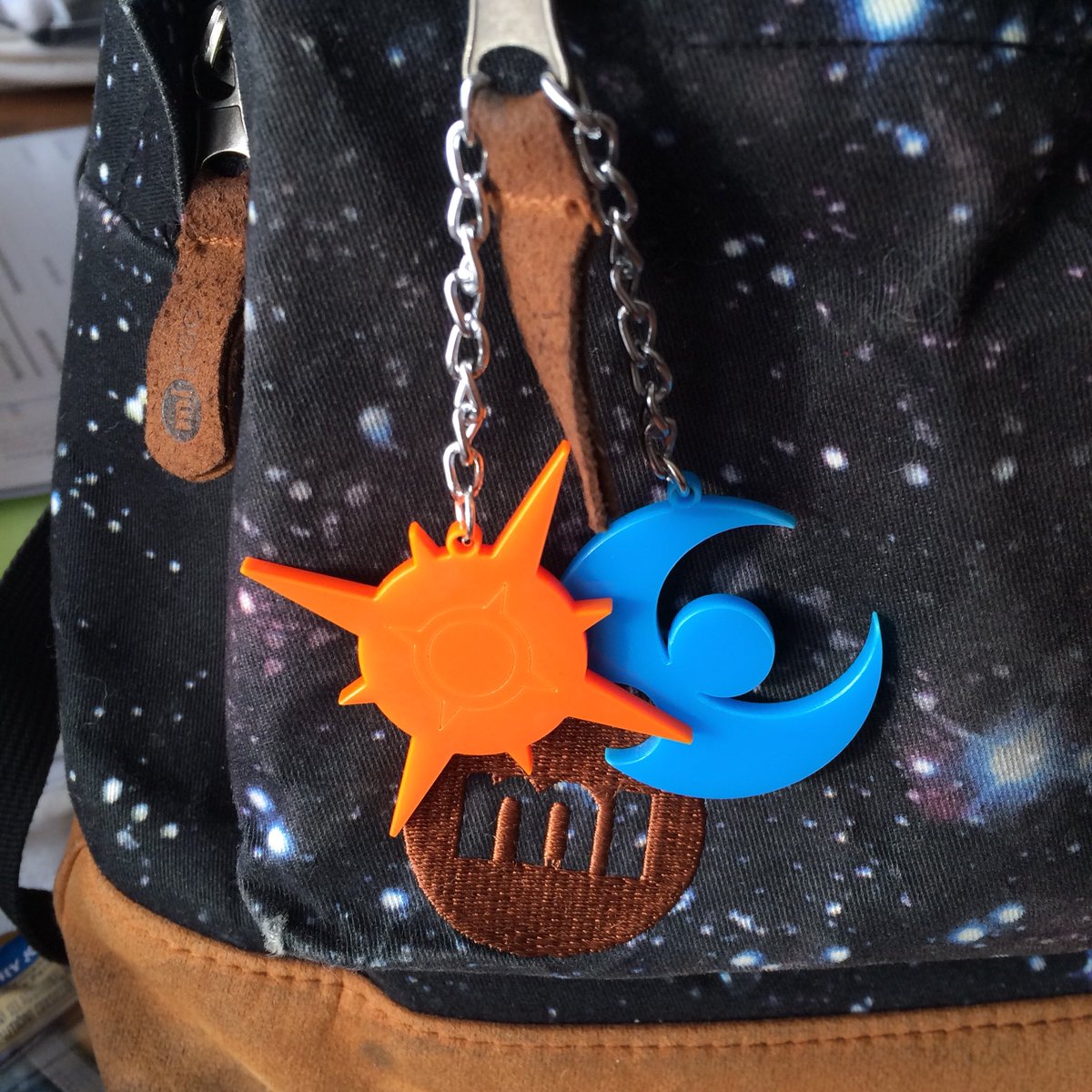 I noticed tons of Sun/Moon symbols in-game, so I made these keychains ...