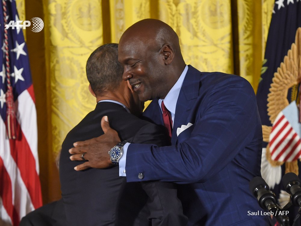 US President Barack Obama and Michael Jordan embrace during the ...