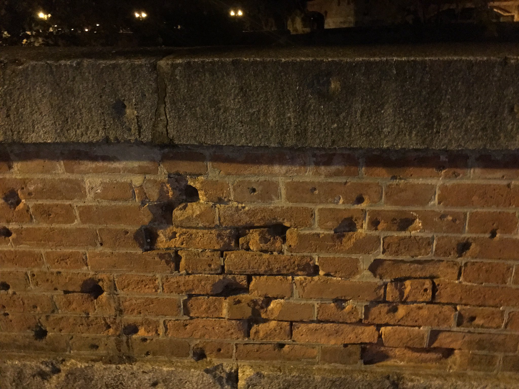 Bullet Holes In Brick Wall