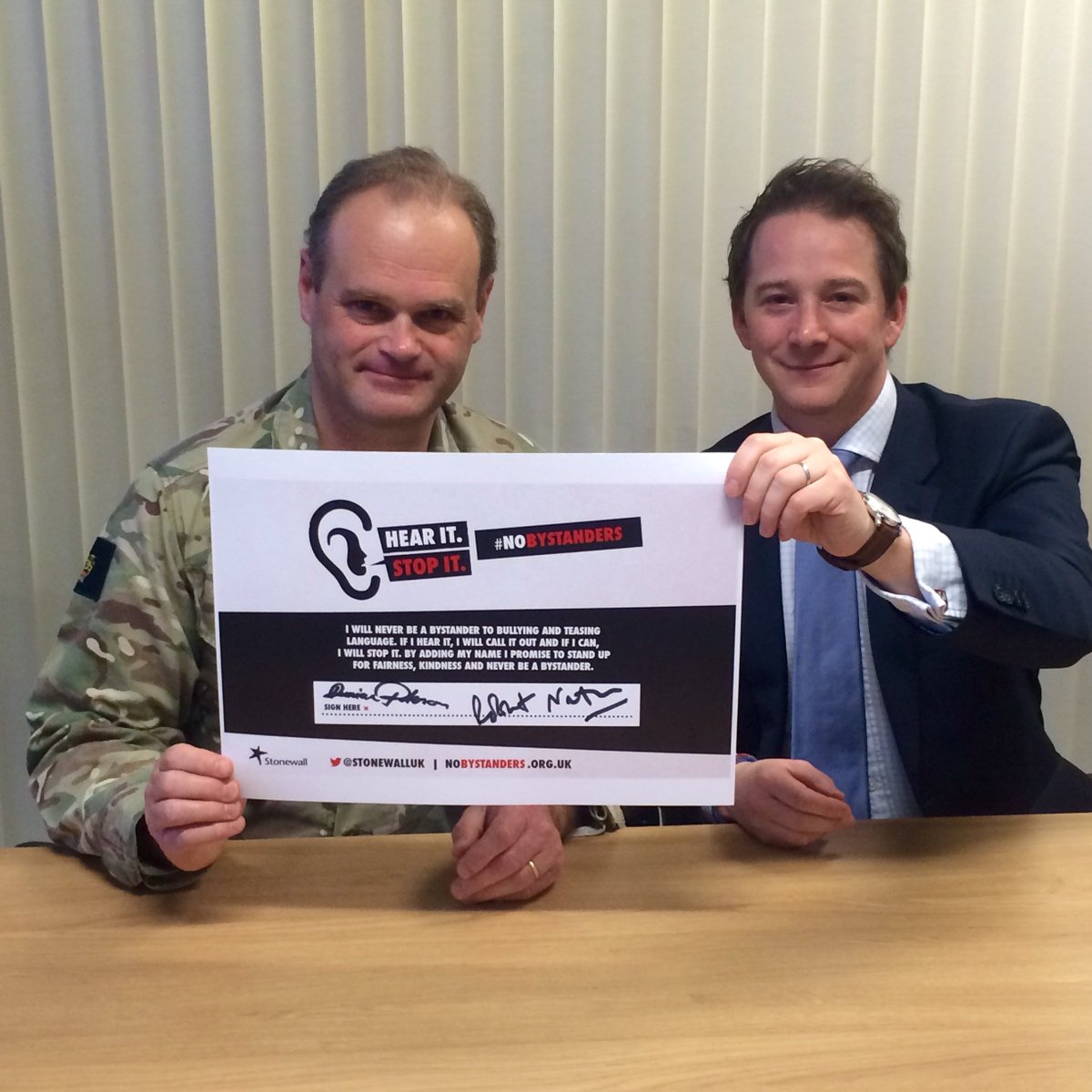 Maj. Gen. Robert Nitsch and senior Civil Servant Damian Paterson sign ...