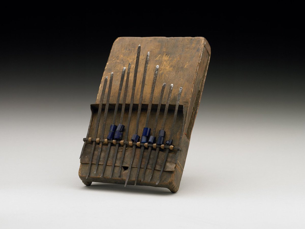 Sanzas, also called Mbiras or thumb-pianos, are played by holding the ...