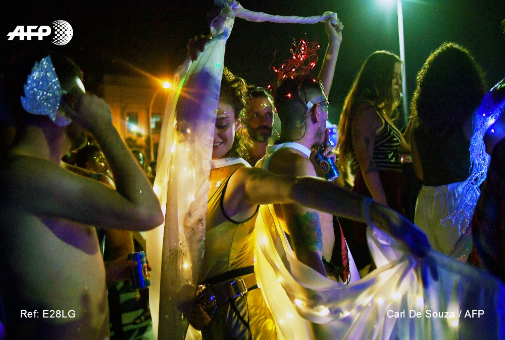 People attend a street party called "Minha Luz e de LED" (My light is ...