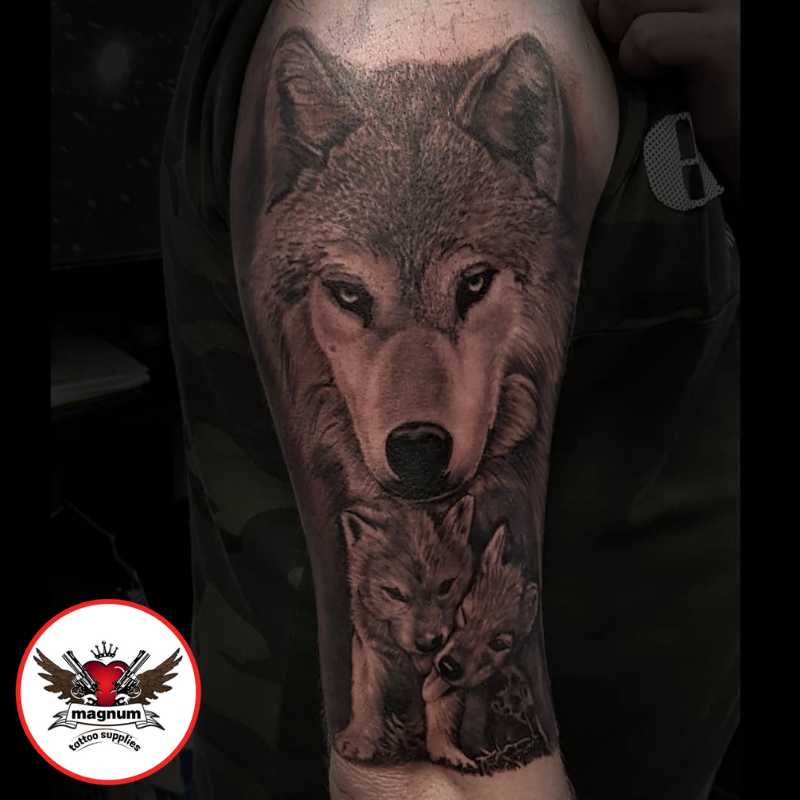 Realistic Wolf Pack Tattoo