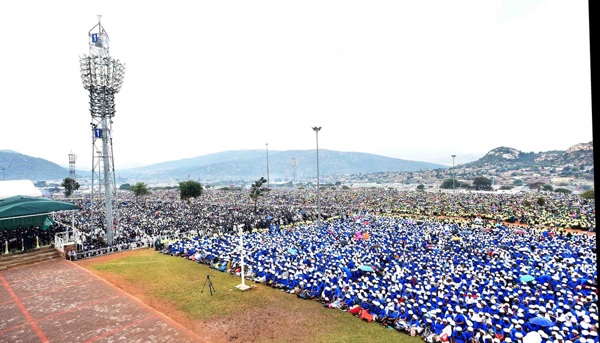 The St. Engenas ZCC Brass Band marching to the Church Service area and ...