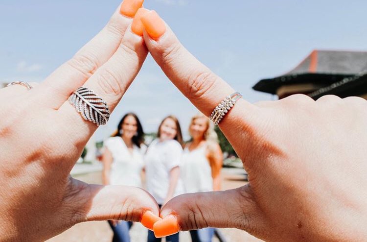 Delta Phi Epsilon Hand Sign