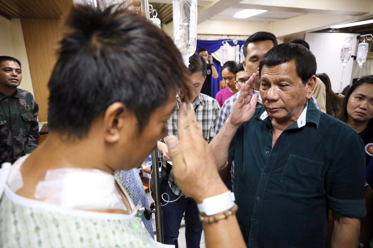 LOOK: Pres. Duterte visits wounded law enforcers at the Adventist ...