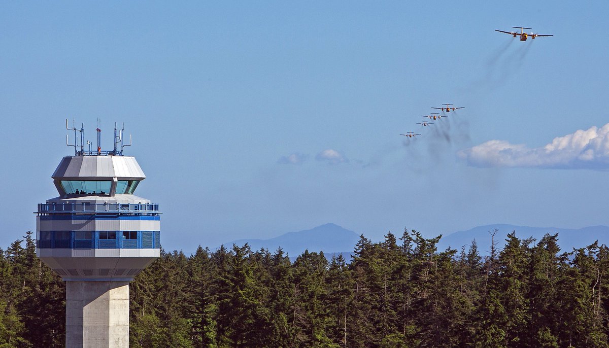 CC-115 Buffalo SAR aircraft fly inline past the Air Traffic Control ...