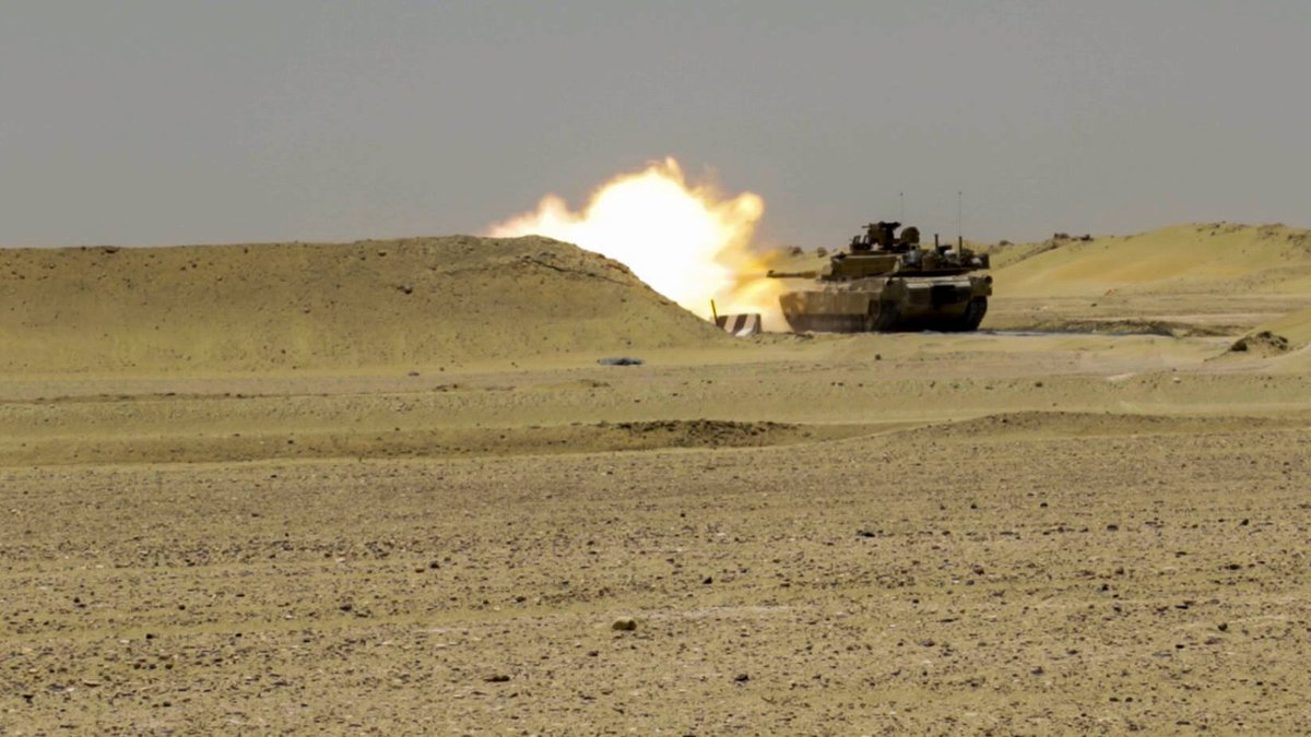 . an m1a2 abrams tank firing rounds during table vi qualification ...