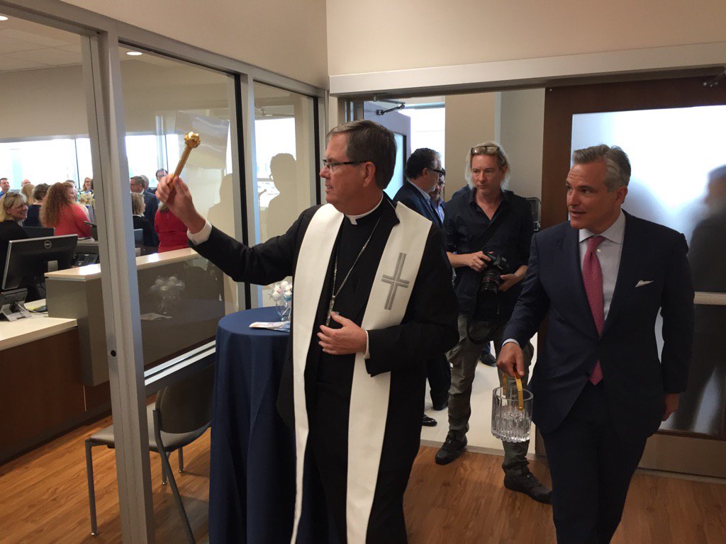 Bishop Timothy Doherty sprinkles water to bless new St. Vincent ...