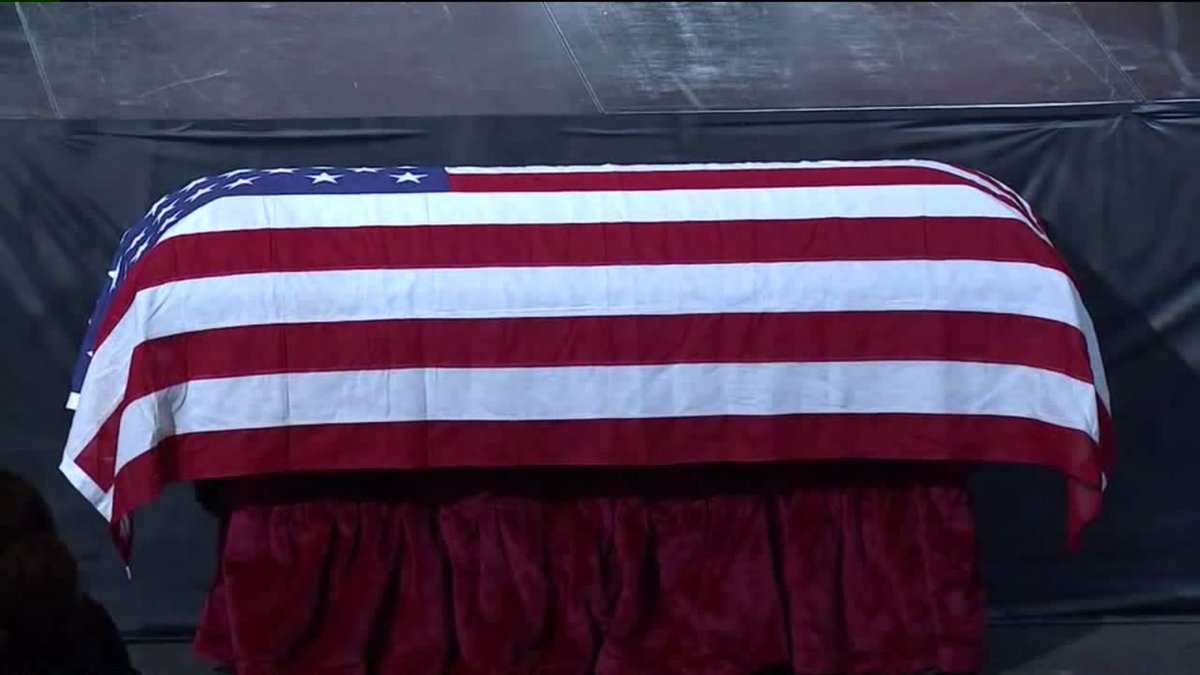 American Flag Draped Over Casket
