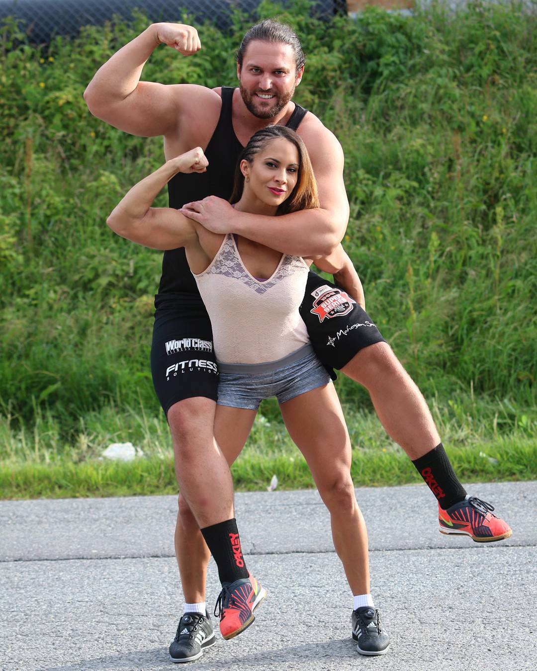 Woman lift and carry man