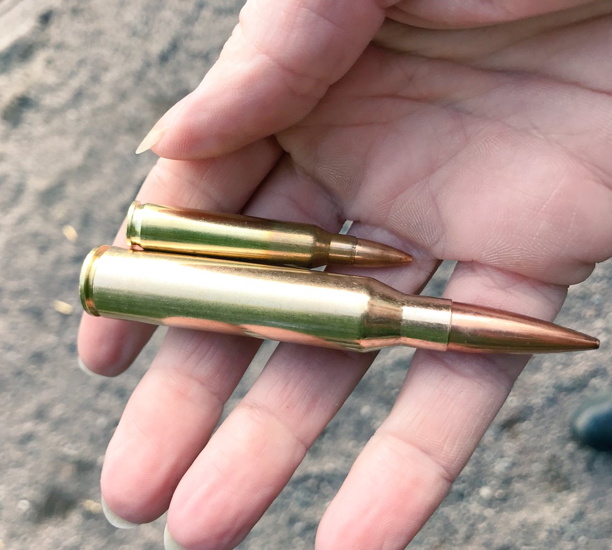 338 Lapua Ammo In Hand