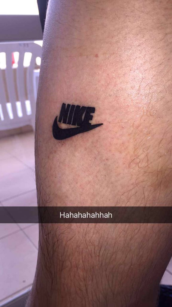 Nike Swoosh Tattoo On Arm