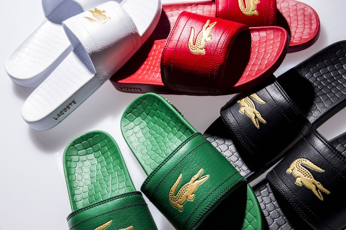 black and gold lacoste slides