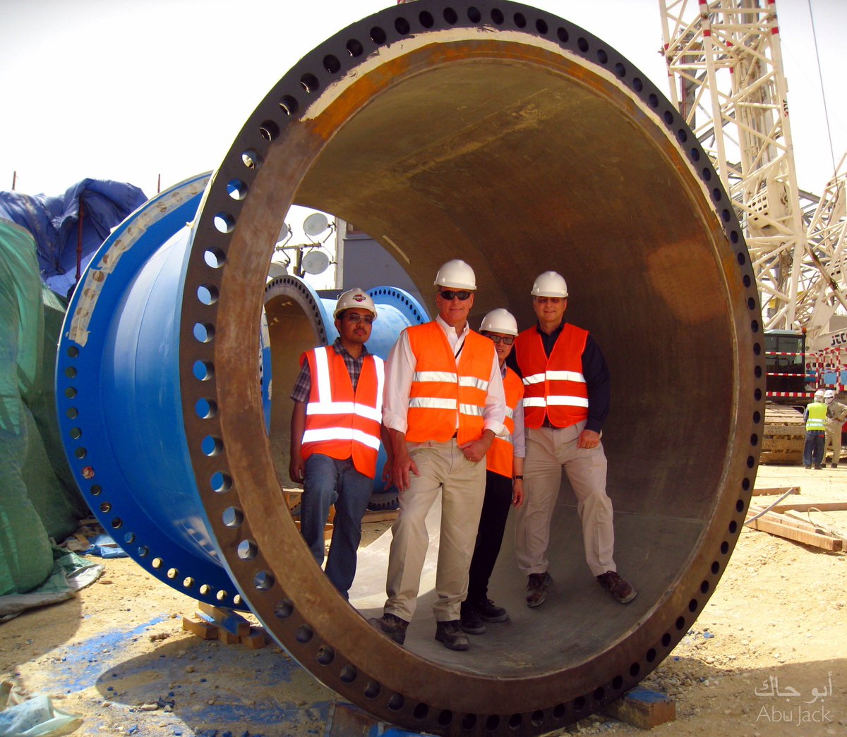 AbuJack and colleagues pose inside a large-bore pipe spool at Jubail ...