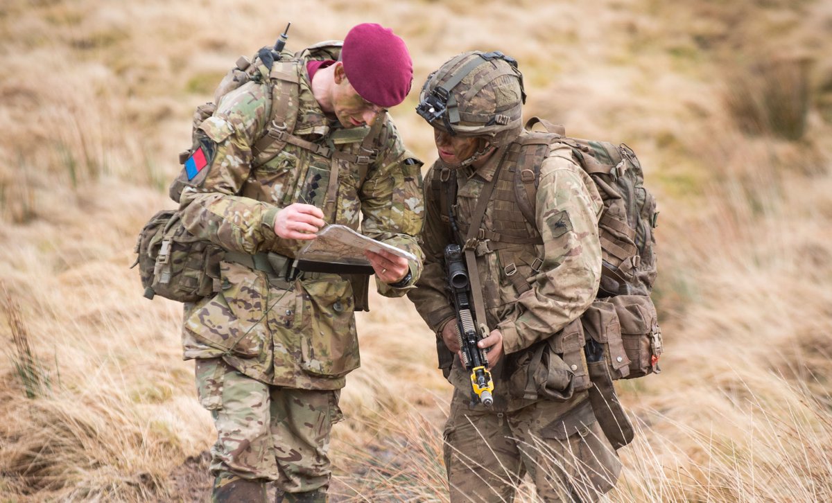 An Instructor checks the route junior soldiers are taking during the ...