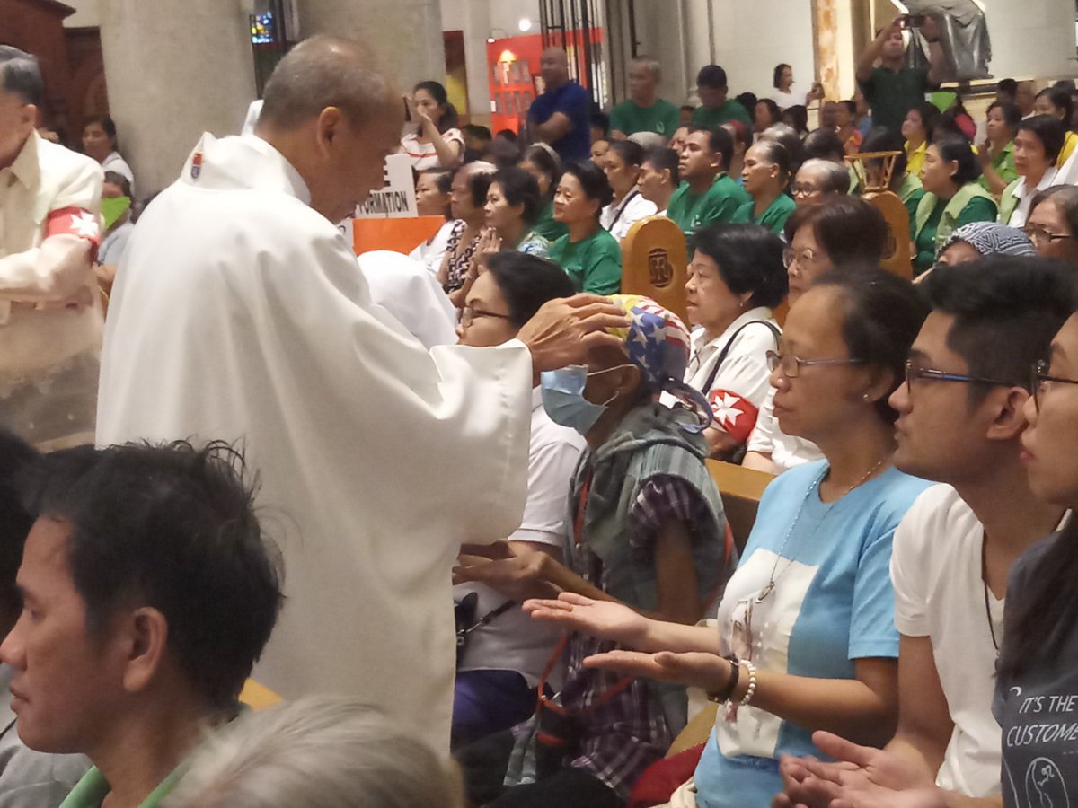 Priests, including lo, going around the manila cathedral to anoint the ...