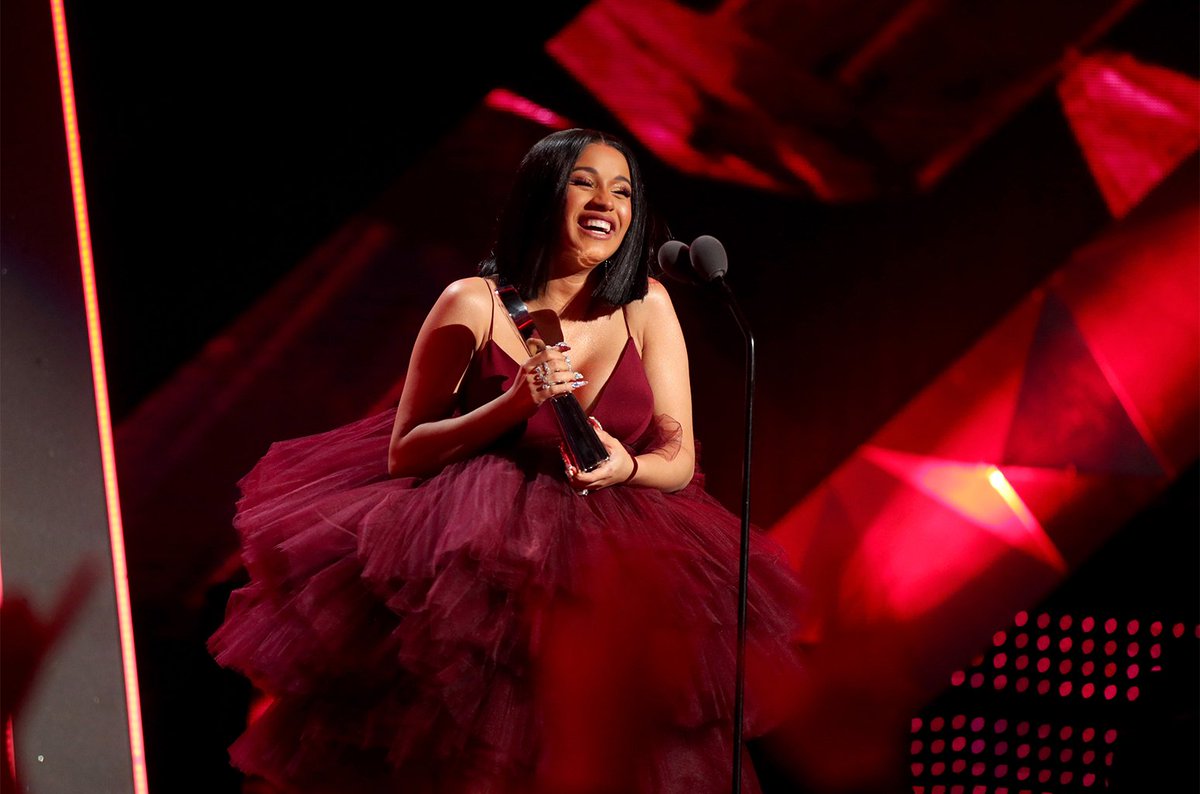 Cardi B was all smiles as she accepted her best new artist award at ...