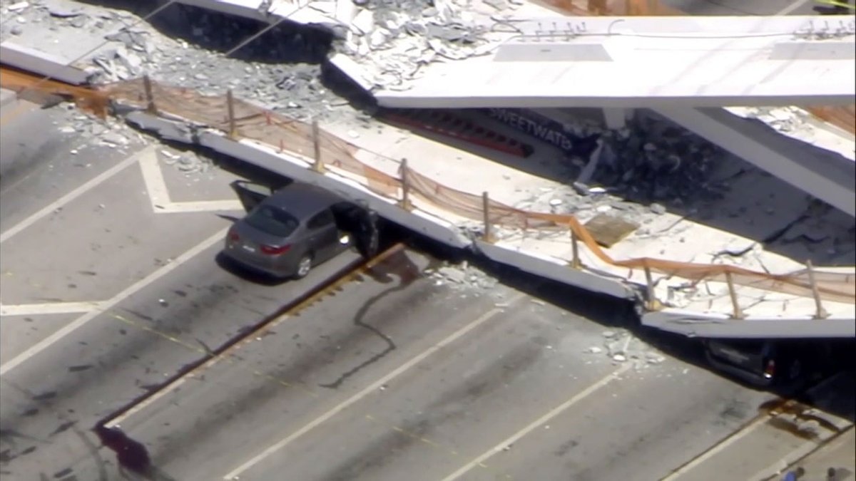 Watch : motorists trapped after pedestrian bridge at florida ...