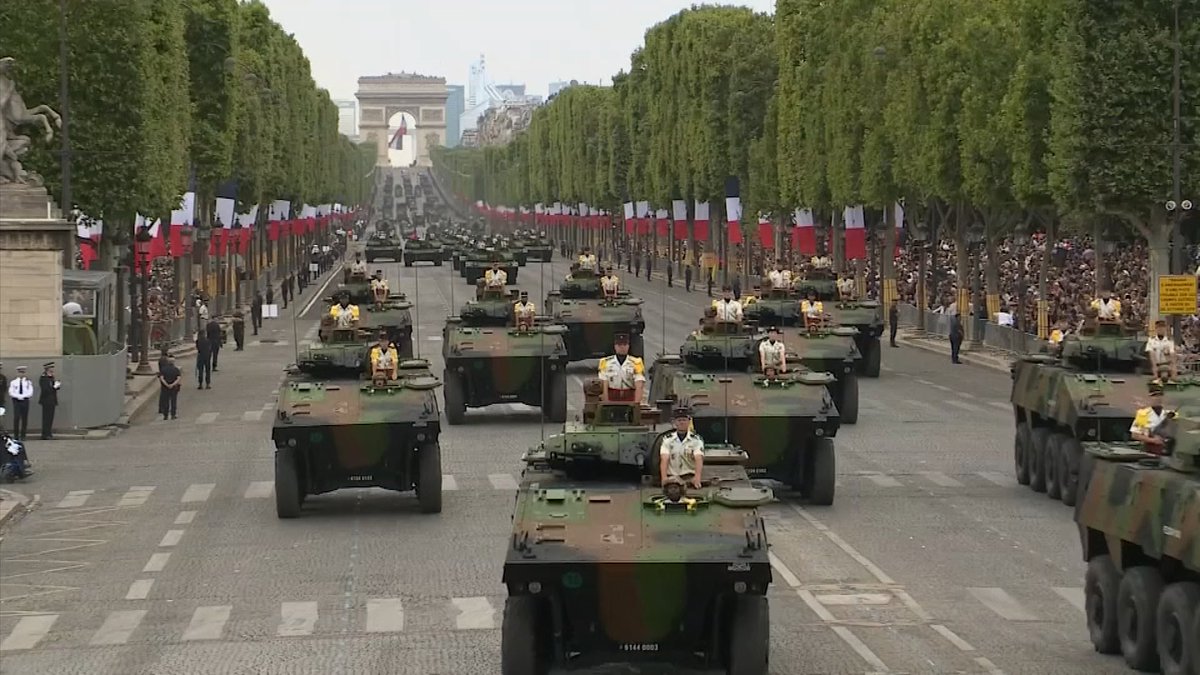 Thousands of people have lined the streets of Paris to watch tanks ...