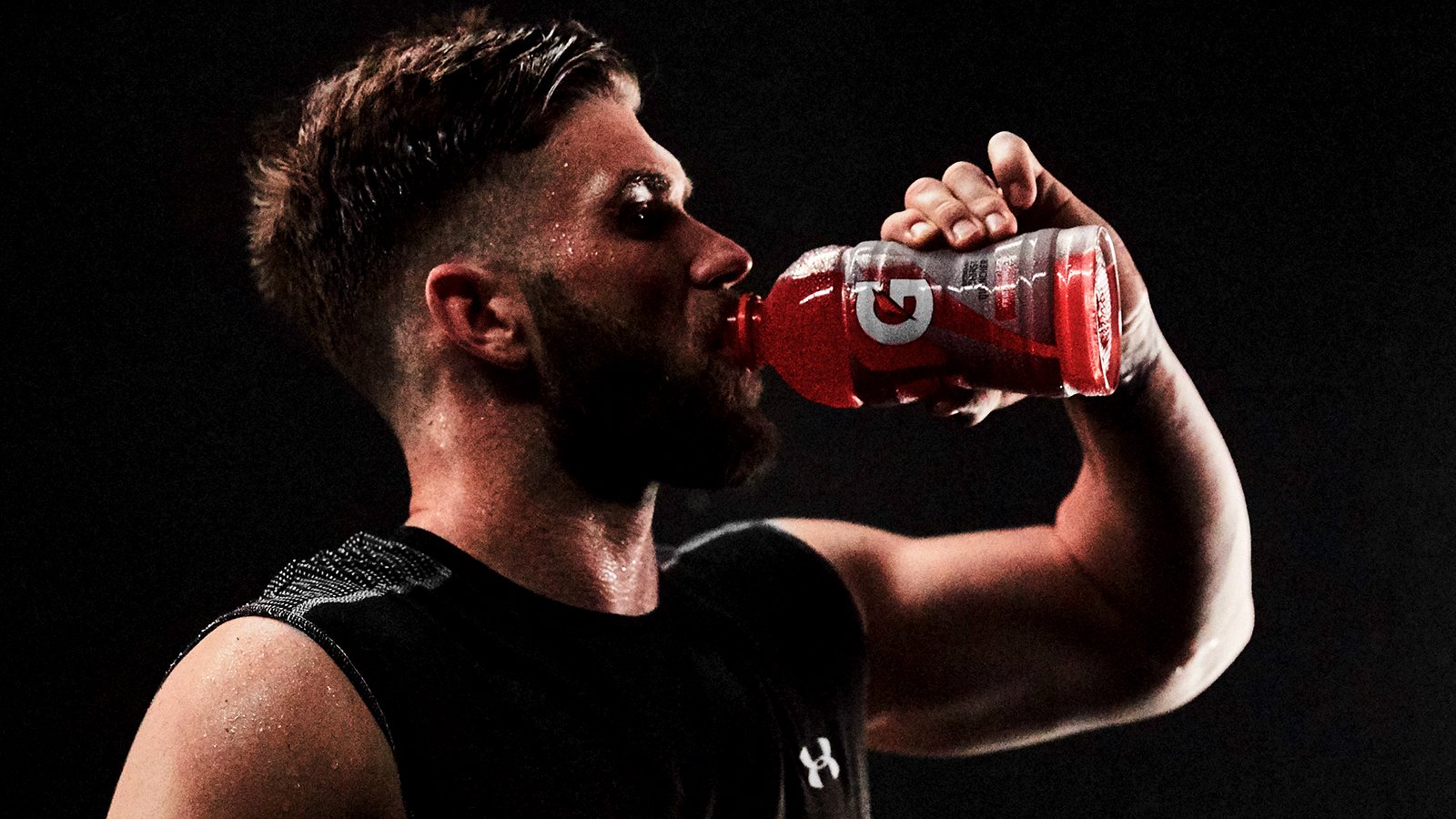 Football Players Drinking Gatorade