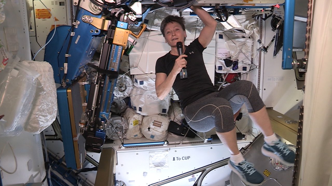 Astronauts Exercising In Space