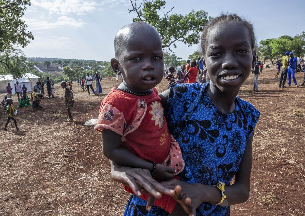Carrying her little brother around Gure Shombola Camp, Ethiopia, this ...