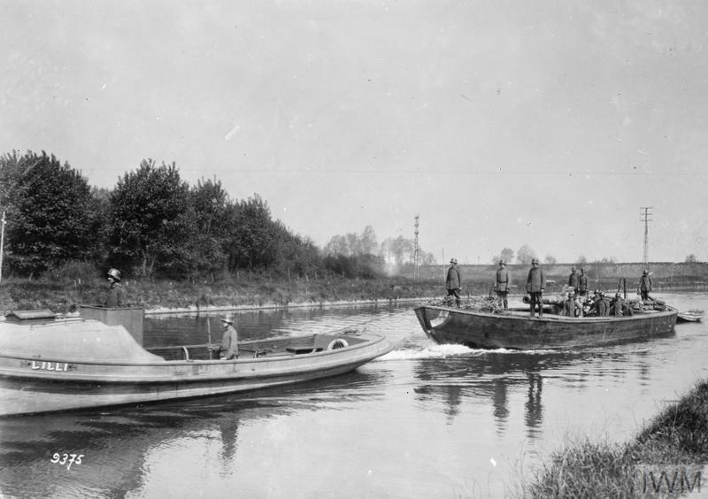 May 1918 - German 15cm gun on a barge being drawn along the Aisne Canal ...