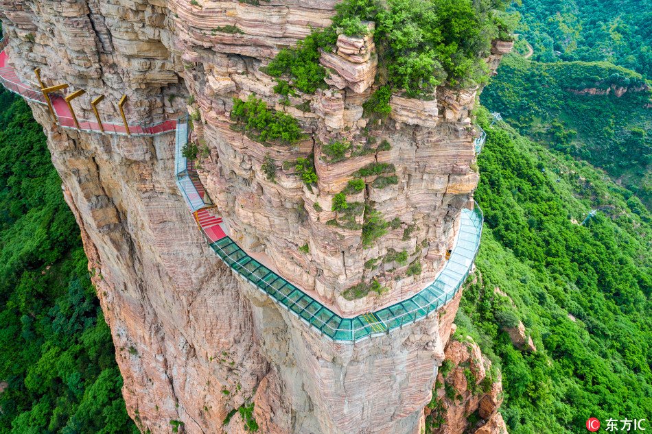 Visitors: For the strong-hearted only: Visitors brave a winding glass ...