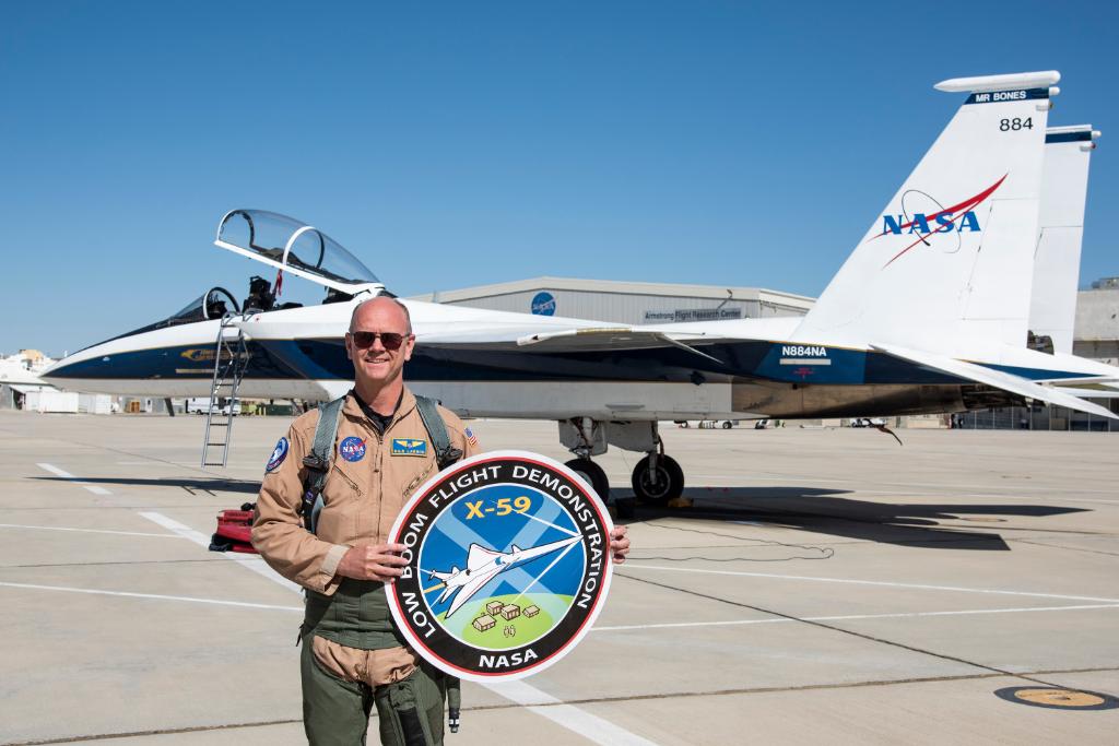 NASA AFRC Chief Pilot Nils Larson holds the mission patch for NASA’s ...