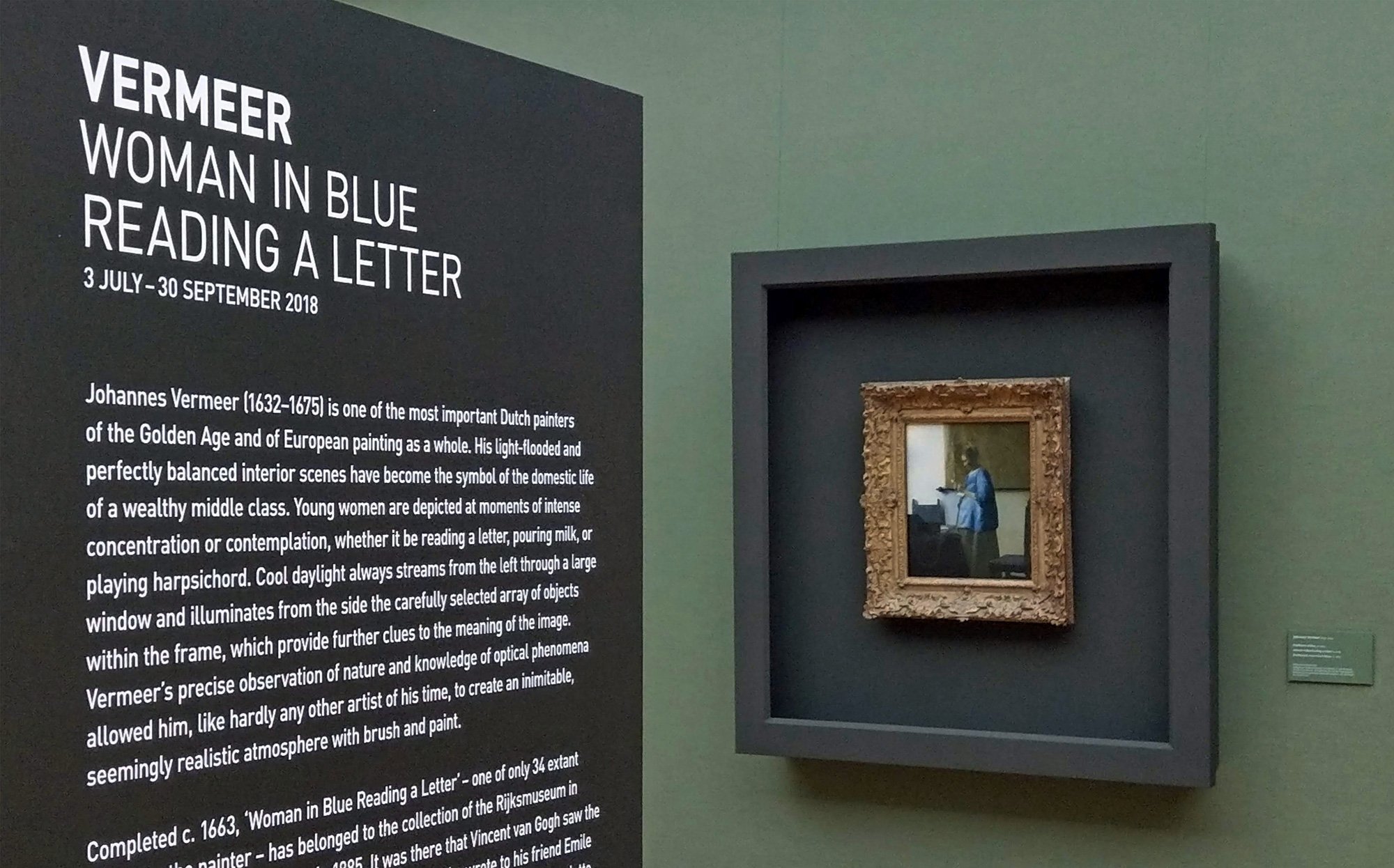 Woman In Blue Reading A Letter