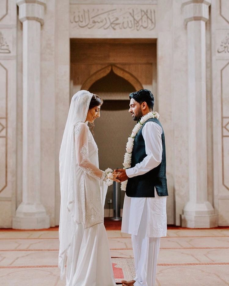 Pakistani Bride And Groom Holding Hands