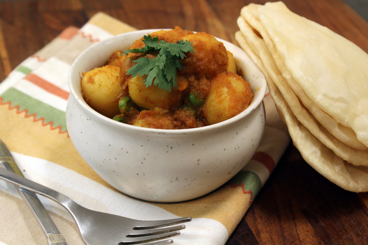 Aloor Dum With Luchi - Light fluffy puris served with Aloo Ki Sabzi - a ...