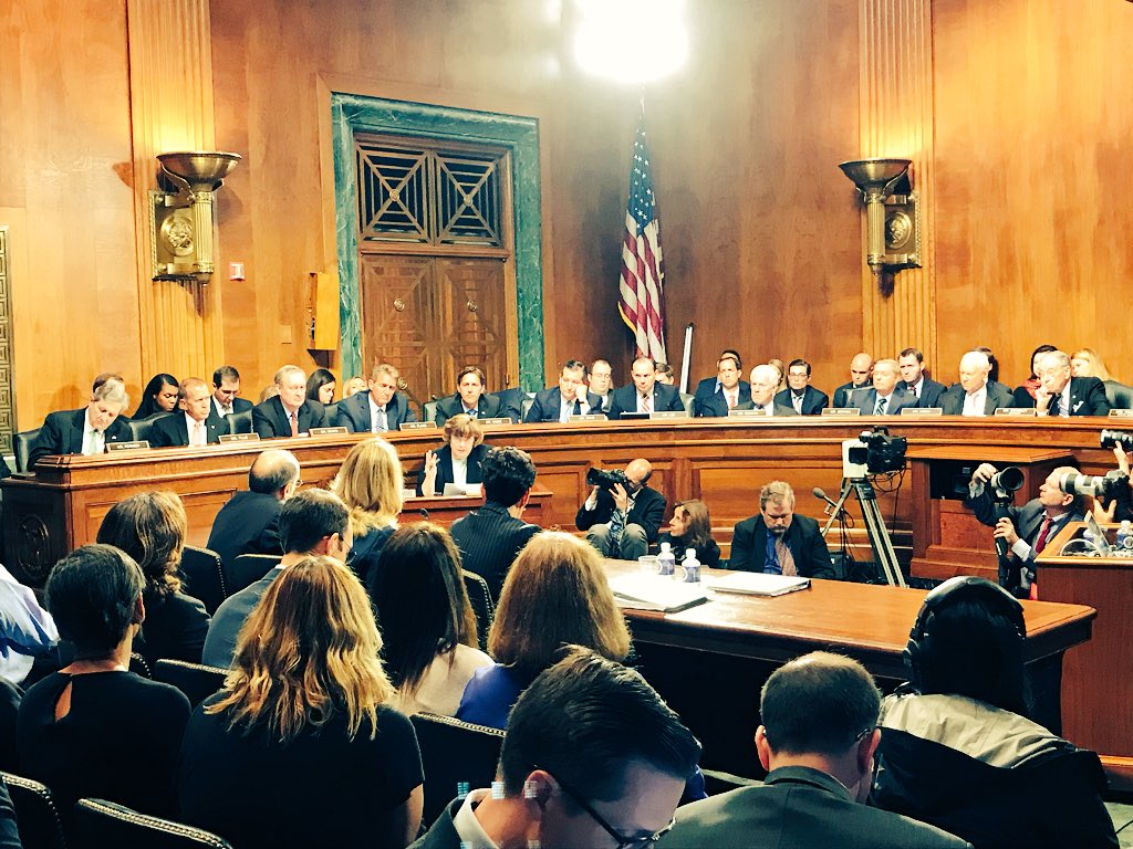 This visual: 11 male Republican senators watching as a female outside ...