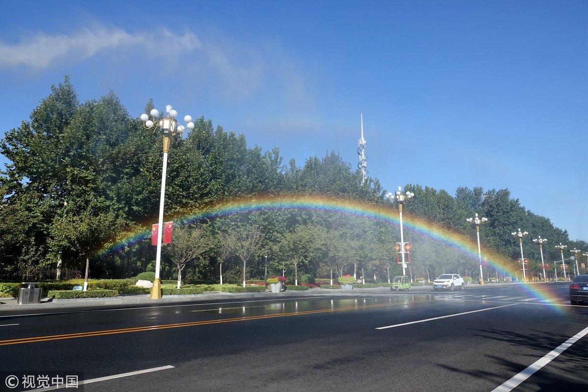 A rainbow has appeared above a road in Langfang City, north China's ...